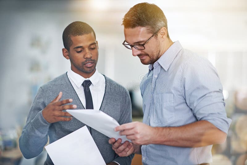 Sharing His Ideas. Two Businessmen Discussing Paperwork. Stock Photo ...