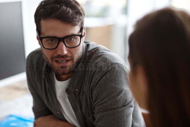 Sharing His Point of View. a Young Designer Conversing Seriously with a ...