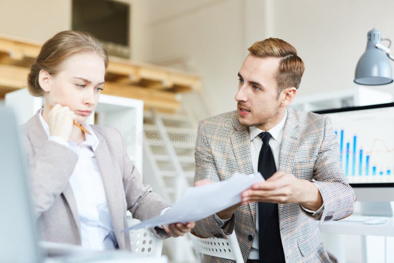 Sharing Ideas with Pretty Coworker Stock Photo - Image of suit, indoors ...