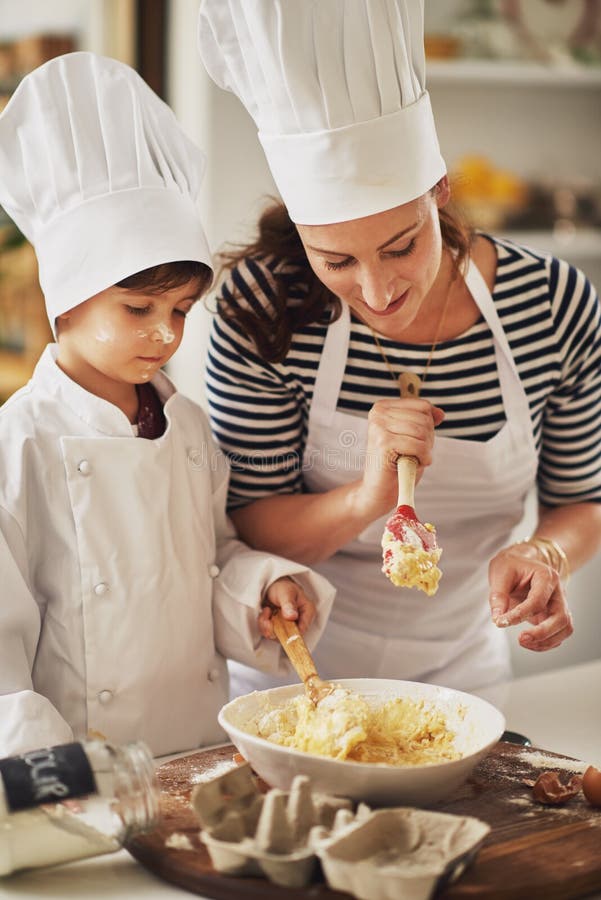 Sharing a Love of Baking. a Mother and Her Young Son Baking Together in ...