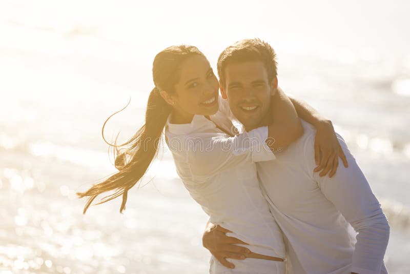 Sharing a Loving Gaze and a Warm Embrace. an Affectionate Young Couple at the Beach. Stock Image ...