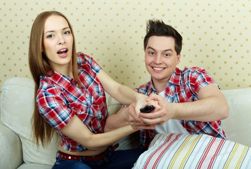 Sharing remote control stock photo. Image of looking - 26817572