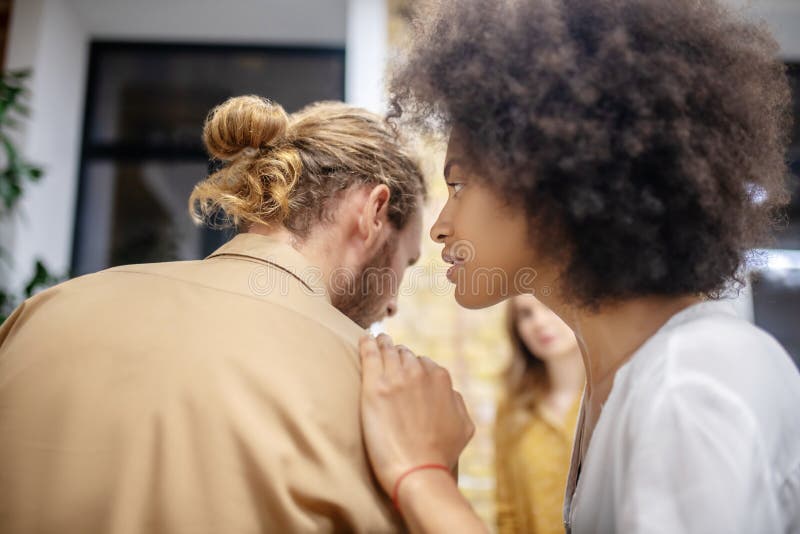 A Girl Sharing Her Secrets on the Ear To Her Friend Stock Image - Image ...