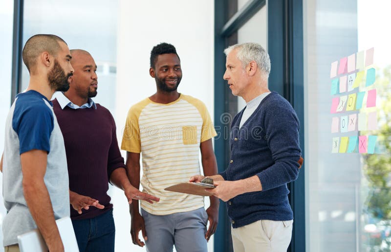 Sharing Some Ideas with His Team. a Group of Creative Colleagues ...