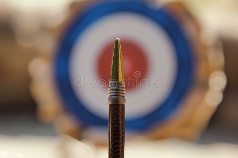Sharp Arrow Tip with Rich, Blurry Target in the Background Stock Photo ...
