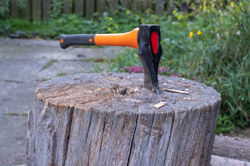 An Ax Inserted in Log in the Backyard. Close Up. Stock Image - Image of ...