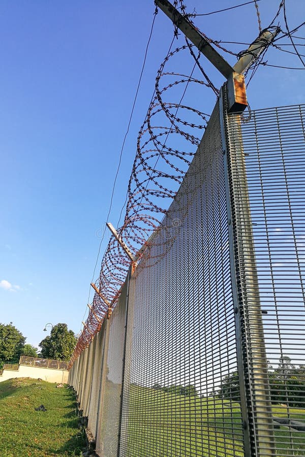 Sharp Barbed Wire on Security Fence Protecti Secure Private Space Stock ...