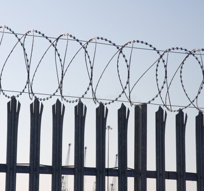Sharp barbed wire spiral stock image. Image of prison - 20536411