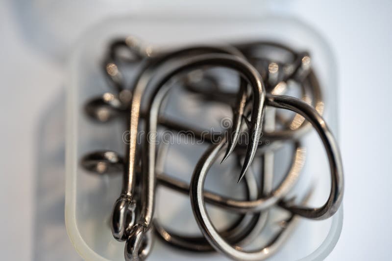 Sharp Big Fishing Hooks are in a Box on a White Background Stock Photo ...
