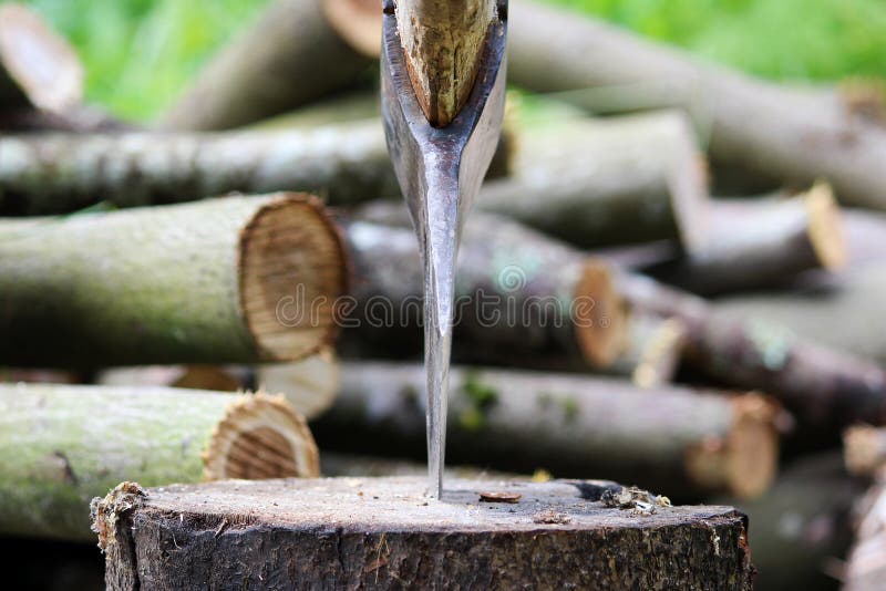 A Sharp Blade of an Ax that Sticks Out in a Wooden Chock. Rustic ...