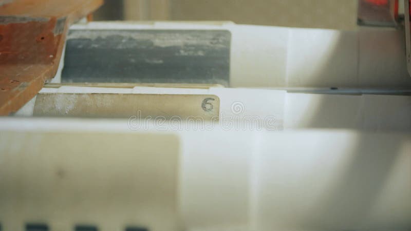 Sharp Blade Cuts Paper Rolls on Conveyor Line at Paper Mill. Stock ...