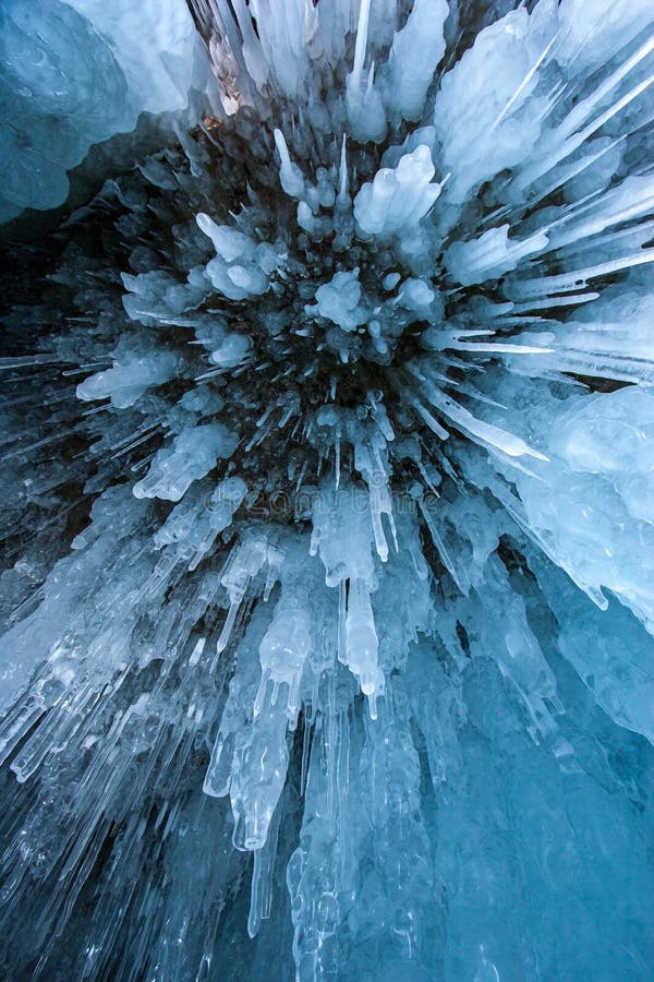 Sharp Blue Icicles Hanging from the Ceiling of the Cave. Stock Photo ...