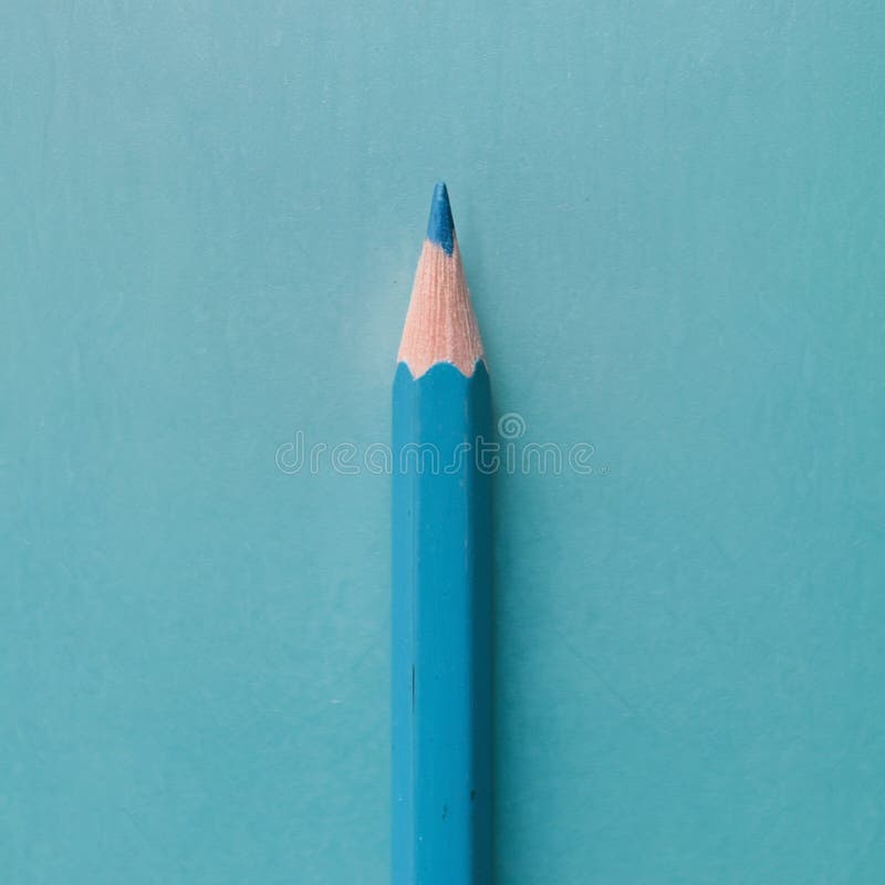 Sharp Blue Pencil Stands Vertically Against Clean Turquoise Backdrop ...