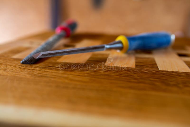 Sharp Chisel and Rasp on Hand Crafted Oak Live Edge Tabletop Stock ...