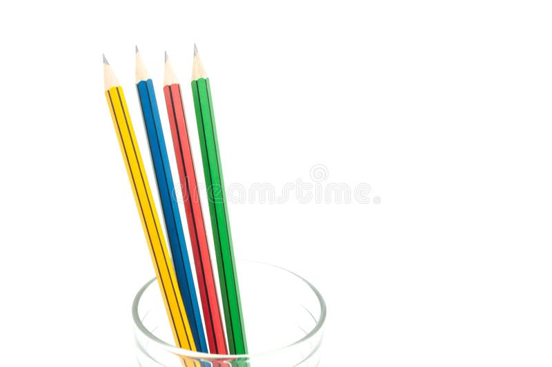 4 Sharp Color Pencils Close Up in a Glass on White Background Stock ...