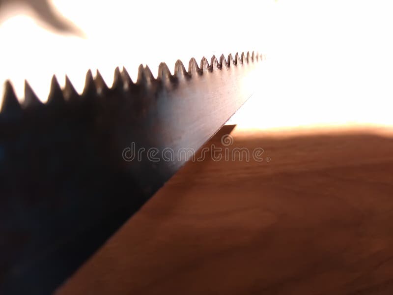 Sharp edge of a Hand saw stock photo. Image of sharp - 195996480