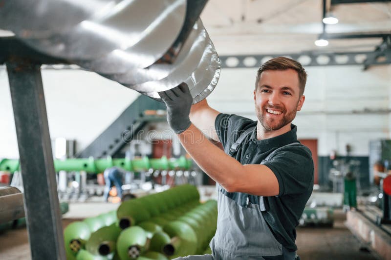 Sharp Edges of Equipment. Man in Uniform is in Workstation Developing ...