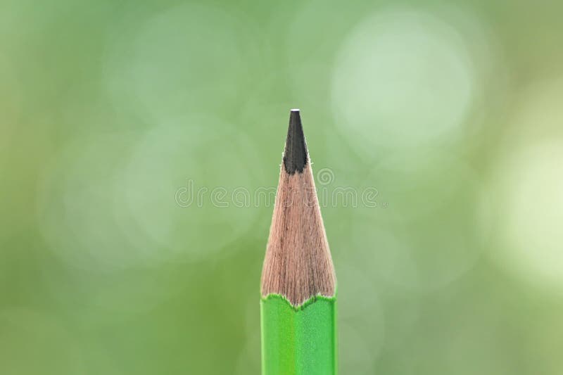 Sharp Green Pencil on Blur Nature Background with Bokeh Stock Photo ...