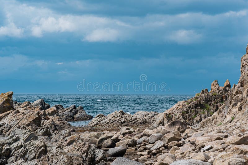 Sharp Jagged Basalt Rocks on the Sea Coast Stock Photo - Image of ...