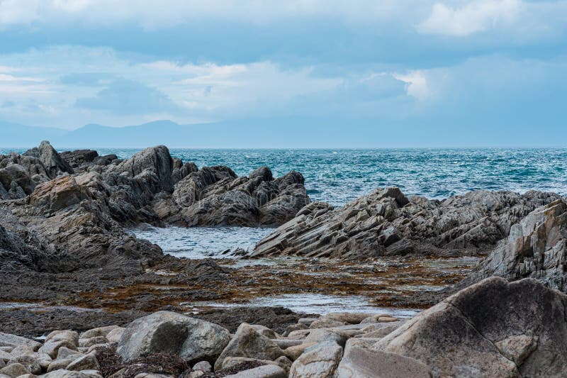Sharp Jagged Basalt Rocks on the Sea Coast Stock Photo - Image of ...