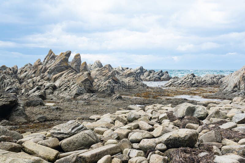 Sharp Jagged Basalt Rocks on the Sea Coast, Cape Stolbchaty on Kunashir ...