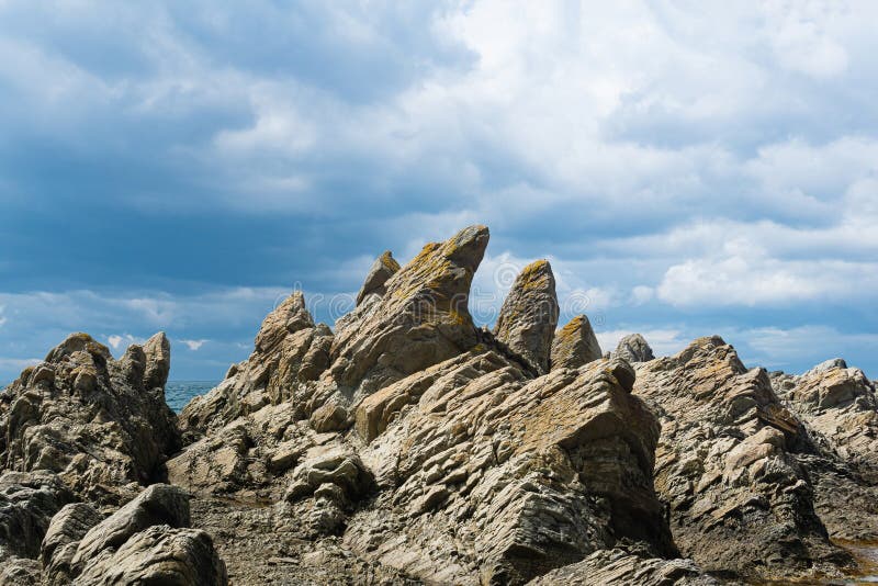 Sharp Jagged Basalt Rocks on the Sea Coast, Cape Stolbchaty on Kunashir ...