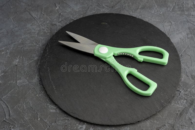 Sharp Kitchen Scissors on a Black Slate Cutting Board in the Kitchen ...
