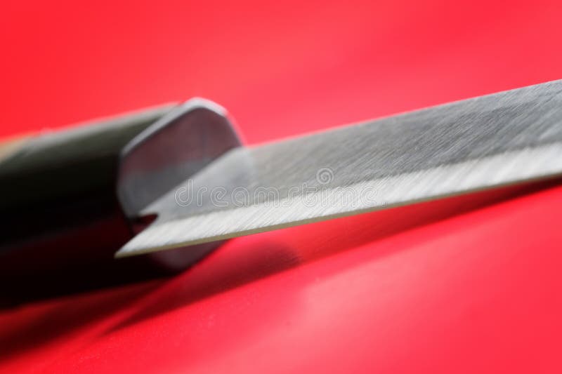 Sharp Knife Blade on a Bright Red Background. the Concept of Threat and ...