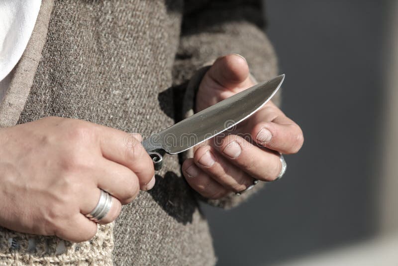 A sharp knife in the hands stock photo. Image of violence - 183148218