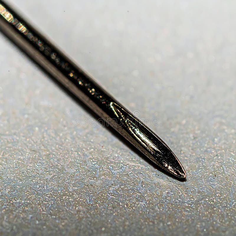 Sharp Metallic Needle Point Glinting with Sharp Precision Against ...