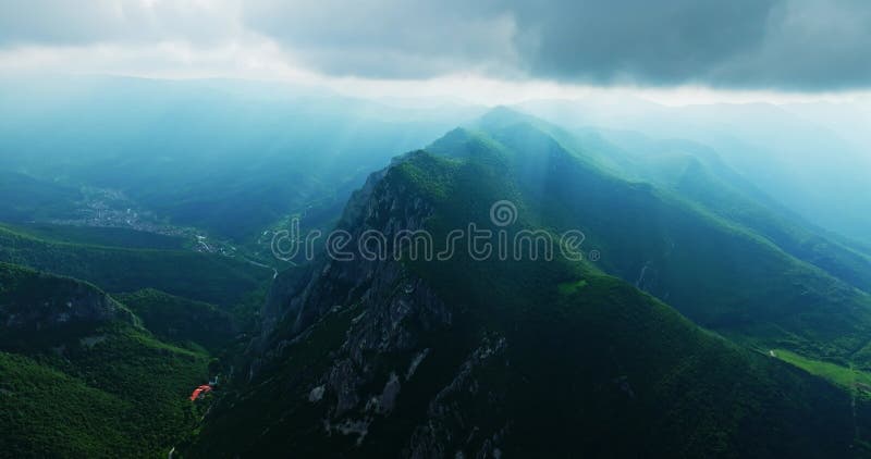 Sharp Mountain Edge Sun Covered in Clouds Sun Rays Shining Aerial Orbit ...