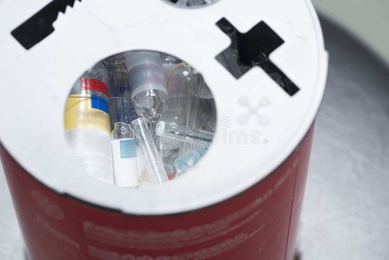 Sharp Objects in Red Container for Biohazard Stock Photo - Image of ...