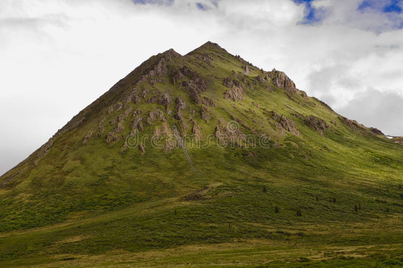 Sharp Peaked Mountains in the Yukon Stock Photo - Image of green ...