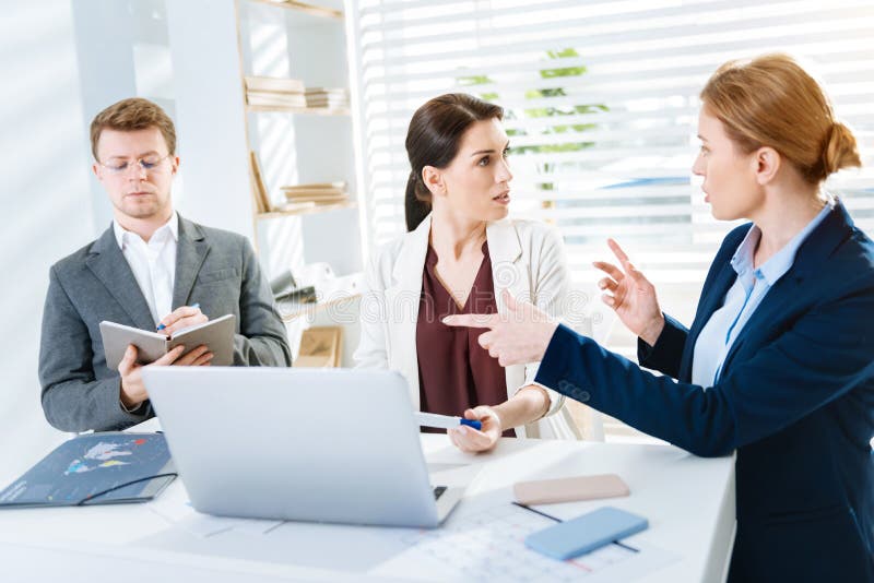 Attractive Three Colleagues Arguing Over Issue Stock Image - Image of ...