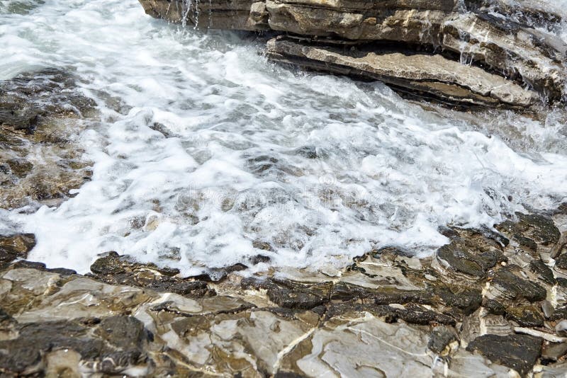 Sharp Rocks on Ocean Coast. Stones and Water Stock Photo - Image of ...