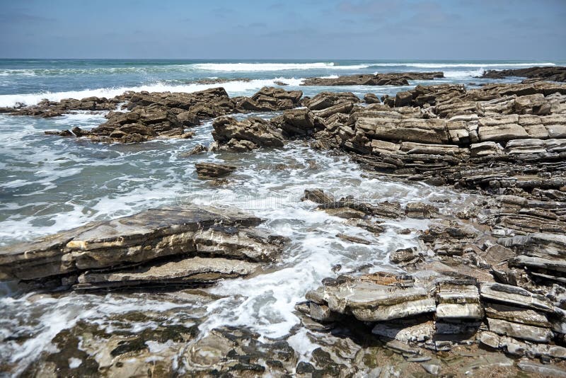 Sharp Rocks on Ocean Coast. Stones and Water Stock Photo - Image of ...