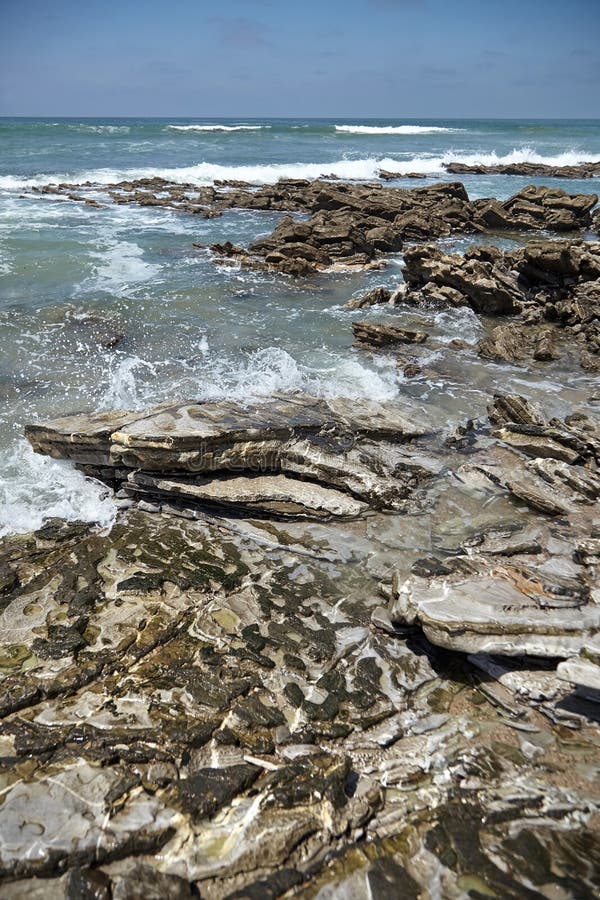Sharp Rocks on Ocean Coast. Stones and Water Stock Photo - Image of ...