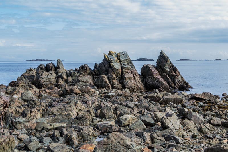 Sharp Rugged Rocks on the Ocean Shore Stock Photo - Image of sunny ...