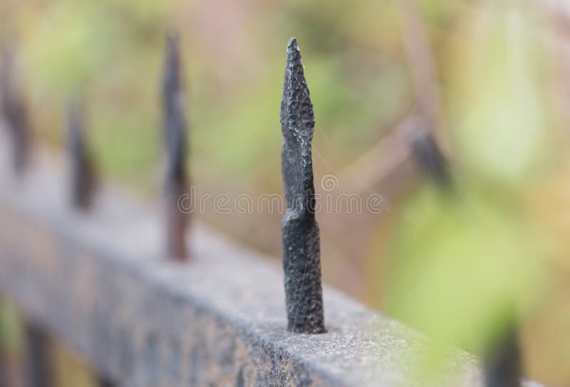 Sharp Rusty Spikes on Residential Boundary Wall Stock Photo - Image of ...
