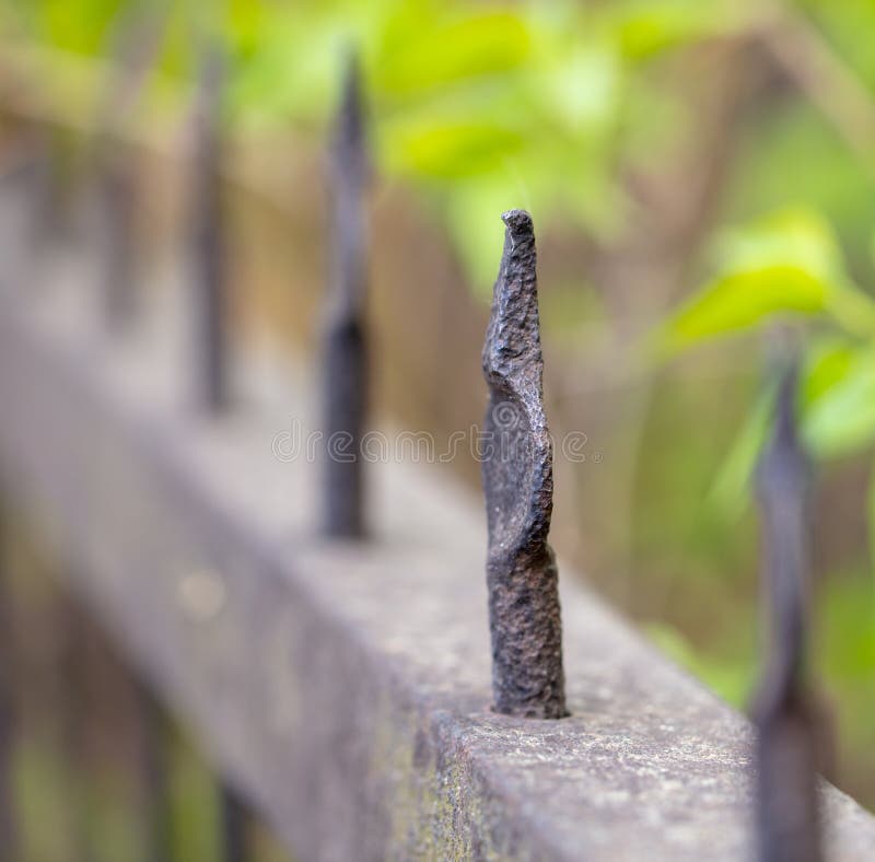 Sharp Rusty Spikes on Residential Boundary Wall Stock Photo - Image of ...