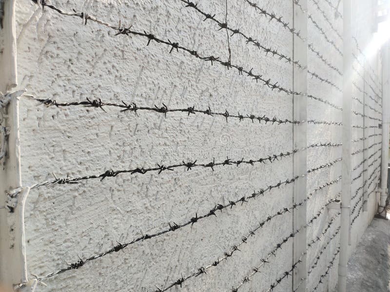 Sharp Rusty Spikes on Residential Boundary Wall Stock Photo - Image of ...