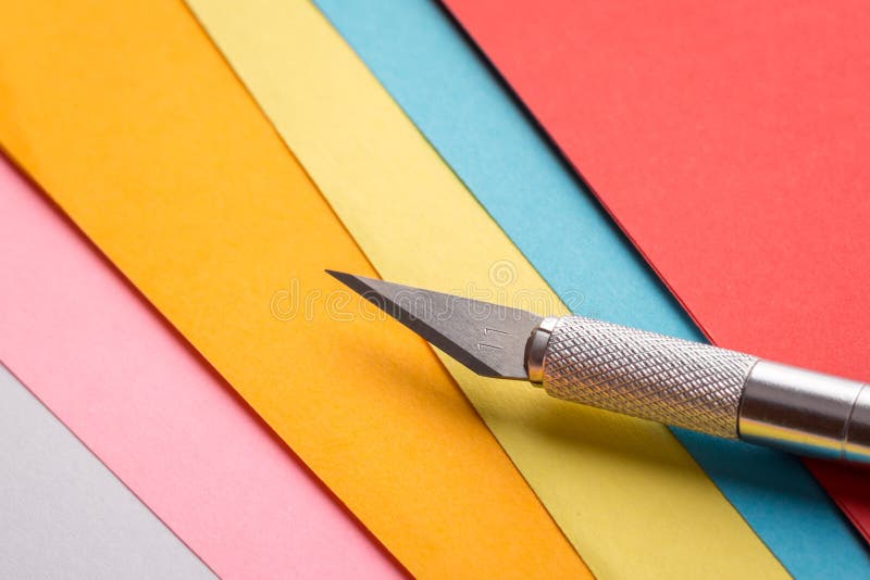 Sharp scalpel on papers stock photo. Image of mockup - 258056026