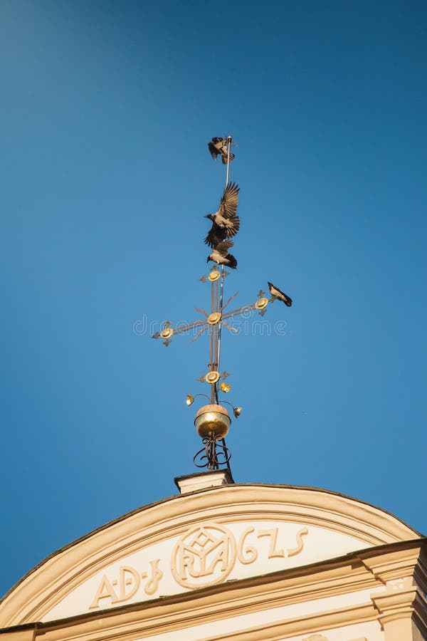 The Sharp Top of the Temple with a Cross and a Raven Stock Image ...