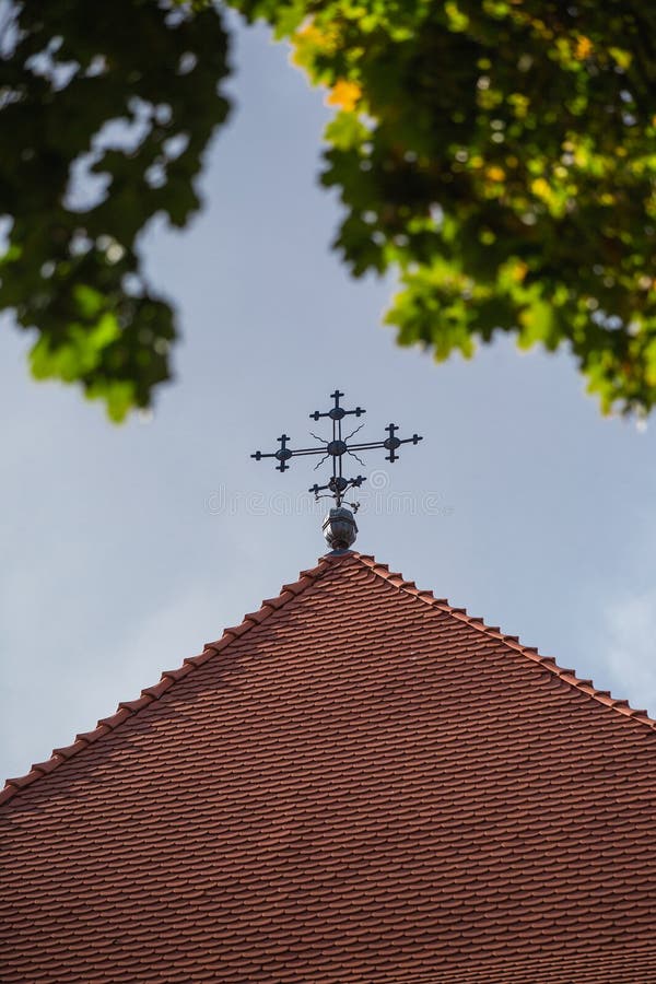 The Sharp Top of the Temple with a Cross and a Raven Stock Image ...