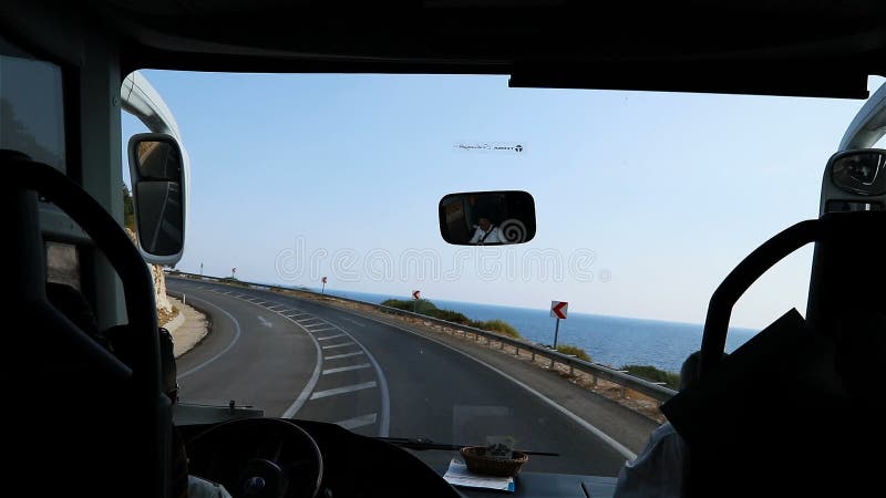 On Sharp Turns, the Driver of the Sightseeing Bus Slows Down Stock ...