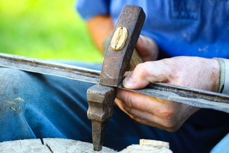 Sharpen the Scythe. Sharpening the Old Scythe with a Hammer. the Farmer ...