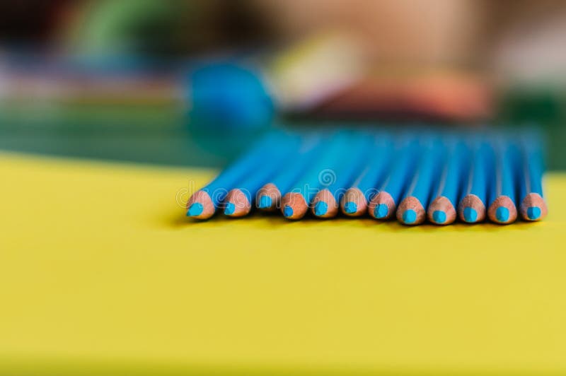 Sharpened Blue Pencils on a Yellow Background. Stock Image - Image of ...
