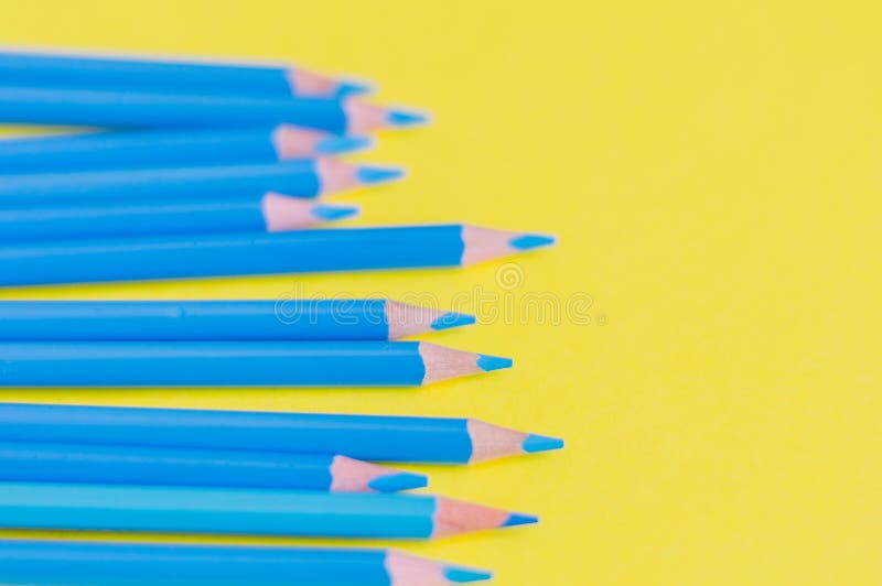 Sharpened Blue Pencils on a Yellow Background. Stock Photo - Image of ...
