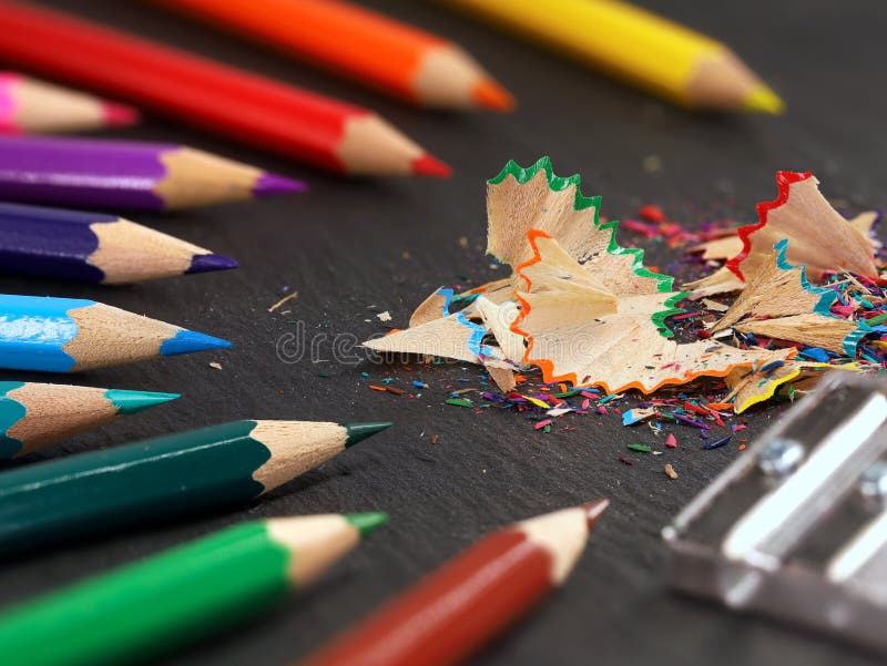 Sharpened Colored Pencils, Crayons and Sharpener with Pencil Shavings ...