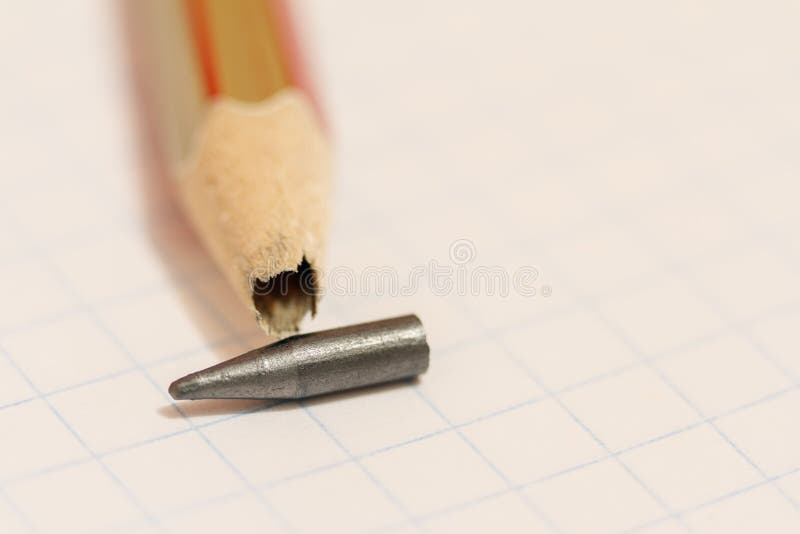 Sharpened Pencil with a Broken Tip Over a Blank Sheet of Paper Stock ...